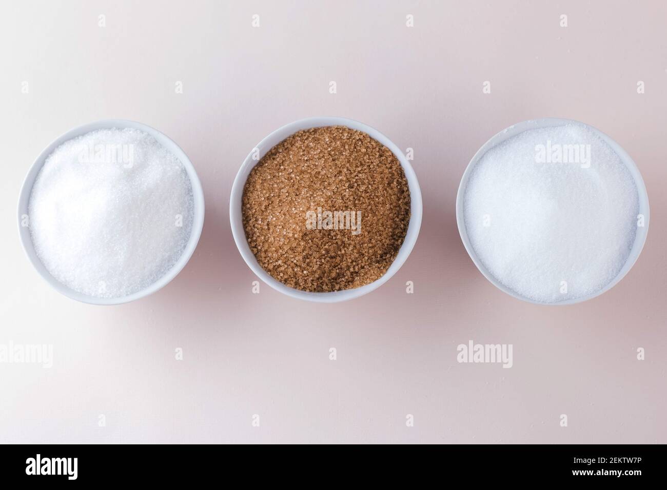 White sugar, cane sugar and sugar substitute in bowls top view Stock ...