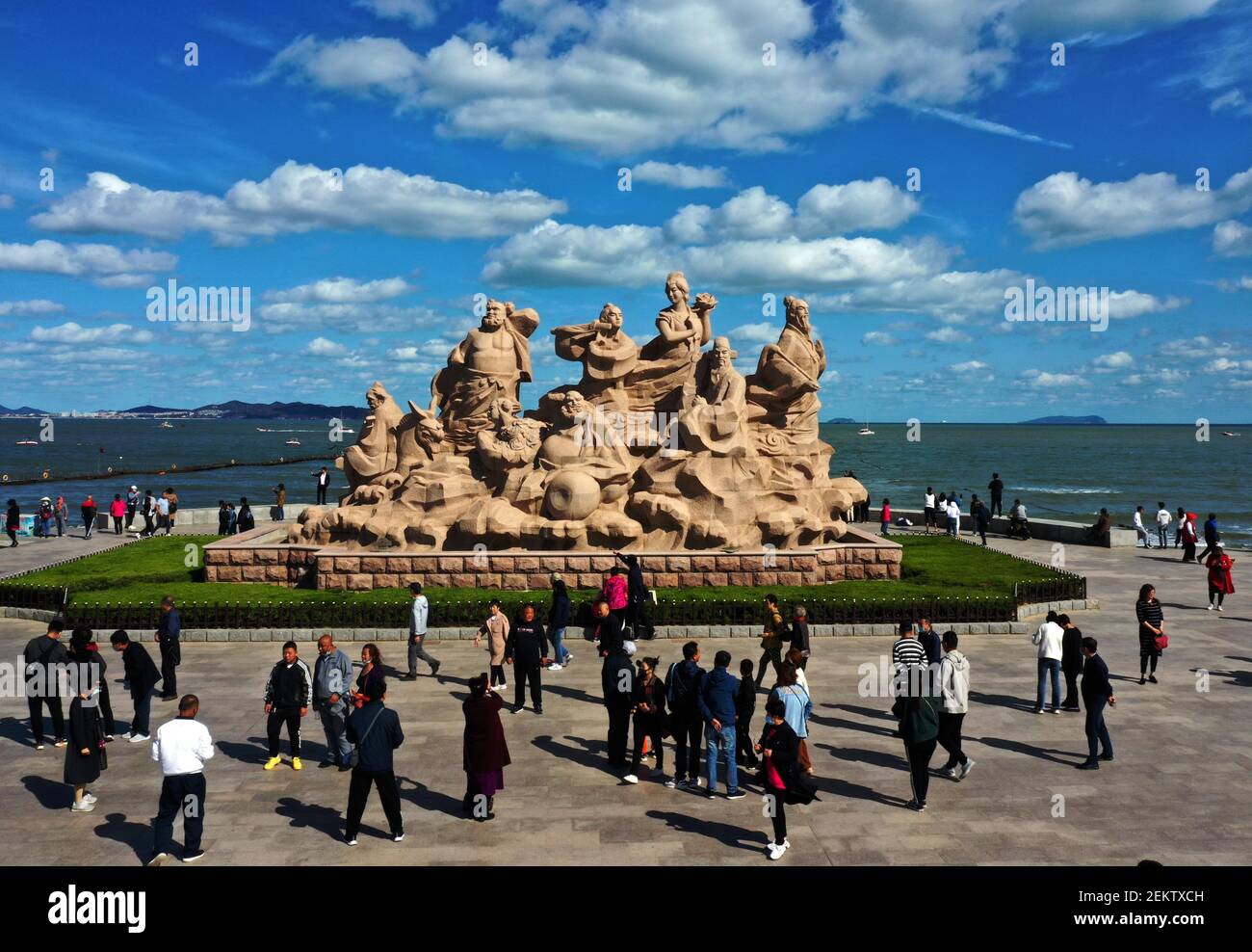 --FILE--Landscape photos of tourists enjoying good weather and ...