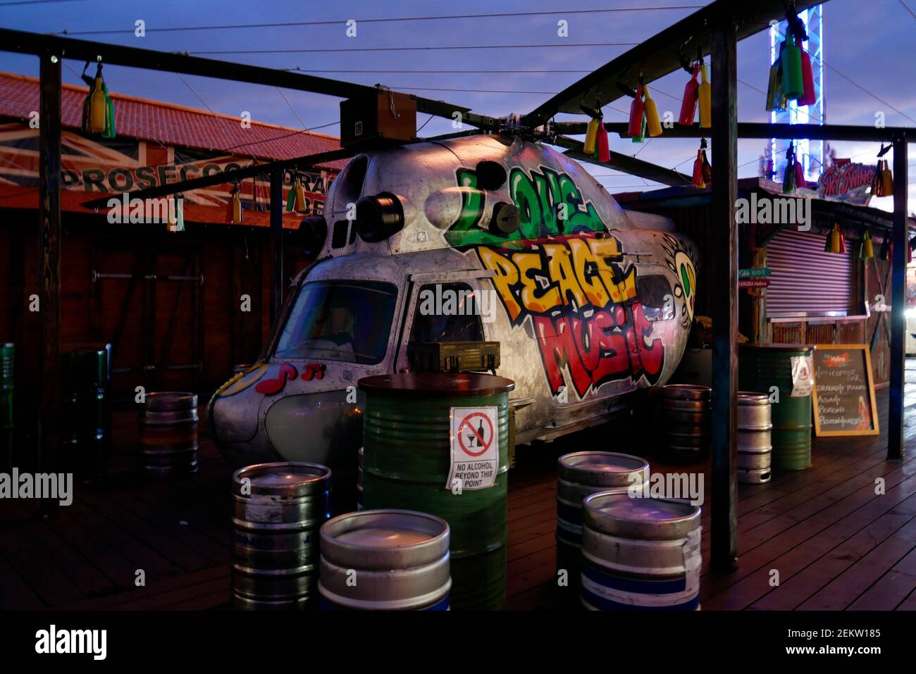 A temporary events bar made form a helicopter, in a hippy or Jamaican ...