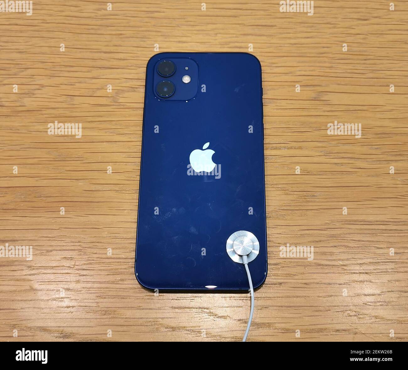 An iPhone of the new 12 series is on display at a flagship in Shanghai ...