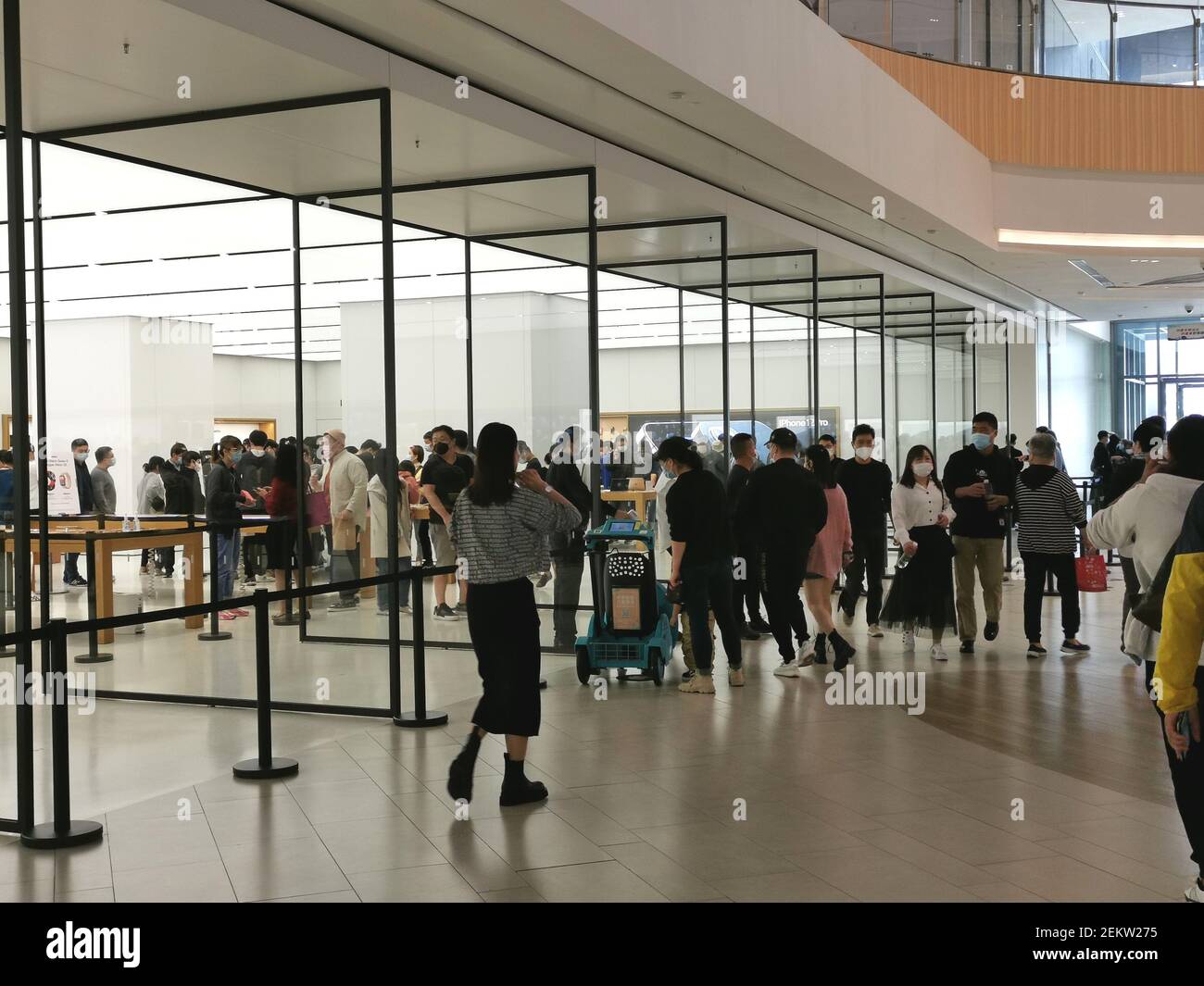 Customers flock to a flagship store of Apple to experience the new ...