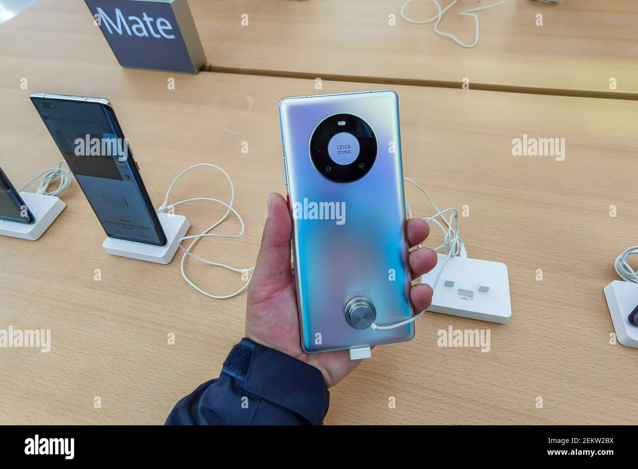 Customers queue at the flagship store of Huawei located on the east ...