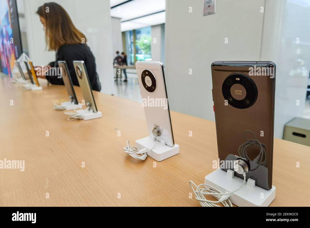 Customers queue at the flagship store of Huawei located on the east ...