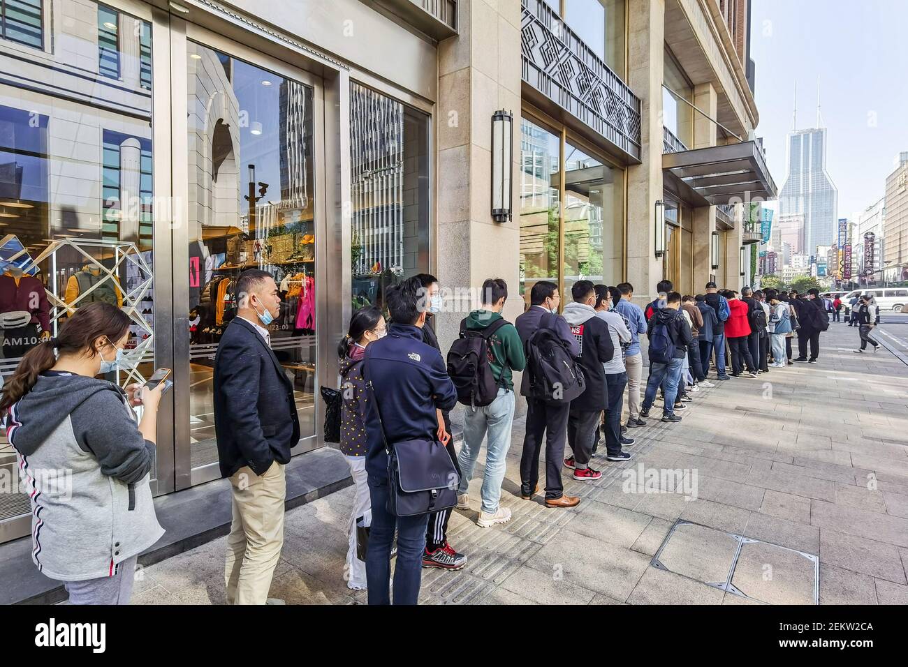 Customers queue at the flagship store of Huawei located on the east ...