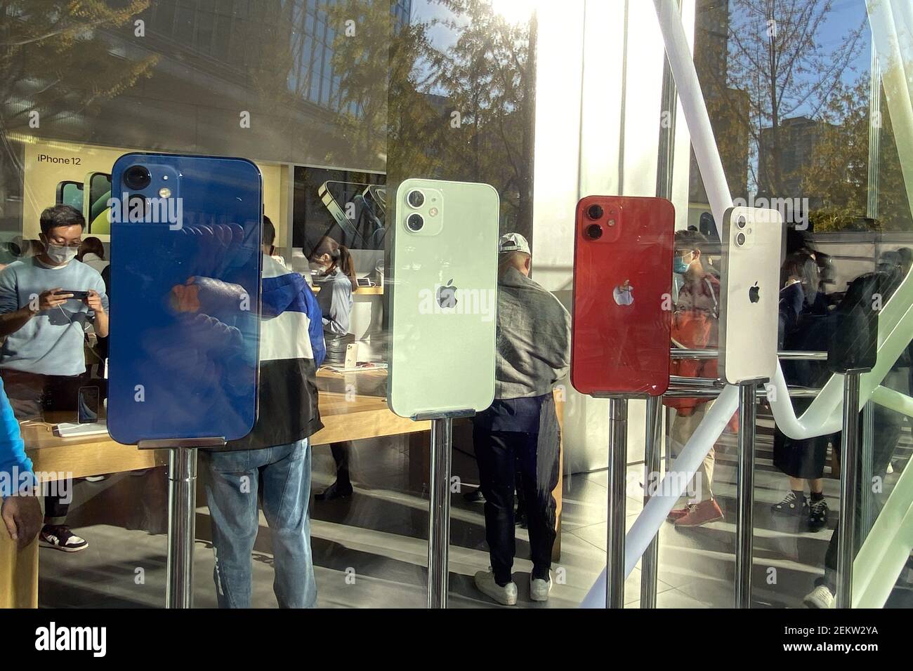 iPhones of the new 12 series are on display at an Apple Store in ...