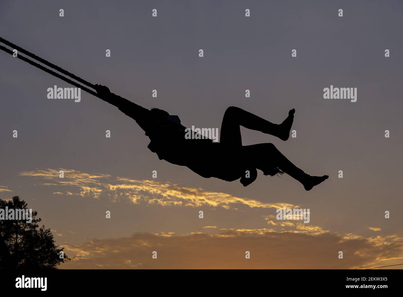 A boy plays on a traditional swing locally known as ping during the ...