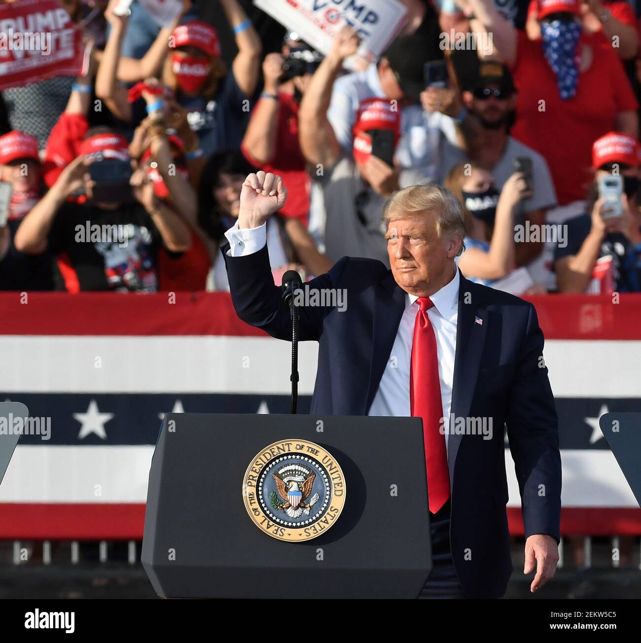 U.S. President Donald Trump gestures as he departs after speaking at a ...