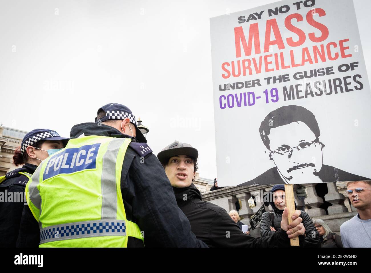 A demonstrator is restrained by the MET police for breaking through the ...