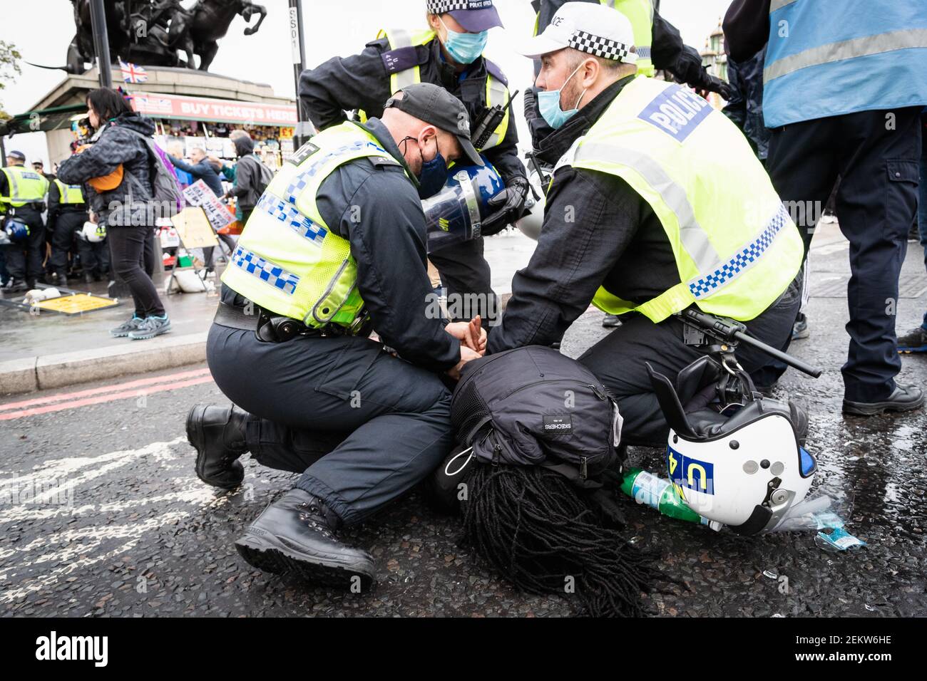 A demonstrator is restrained by the MET police for breaking through the ...