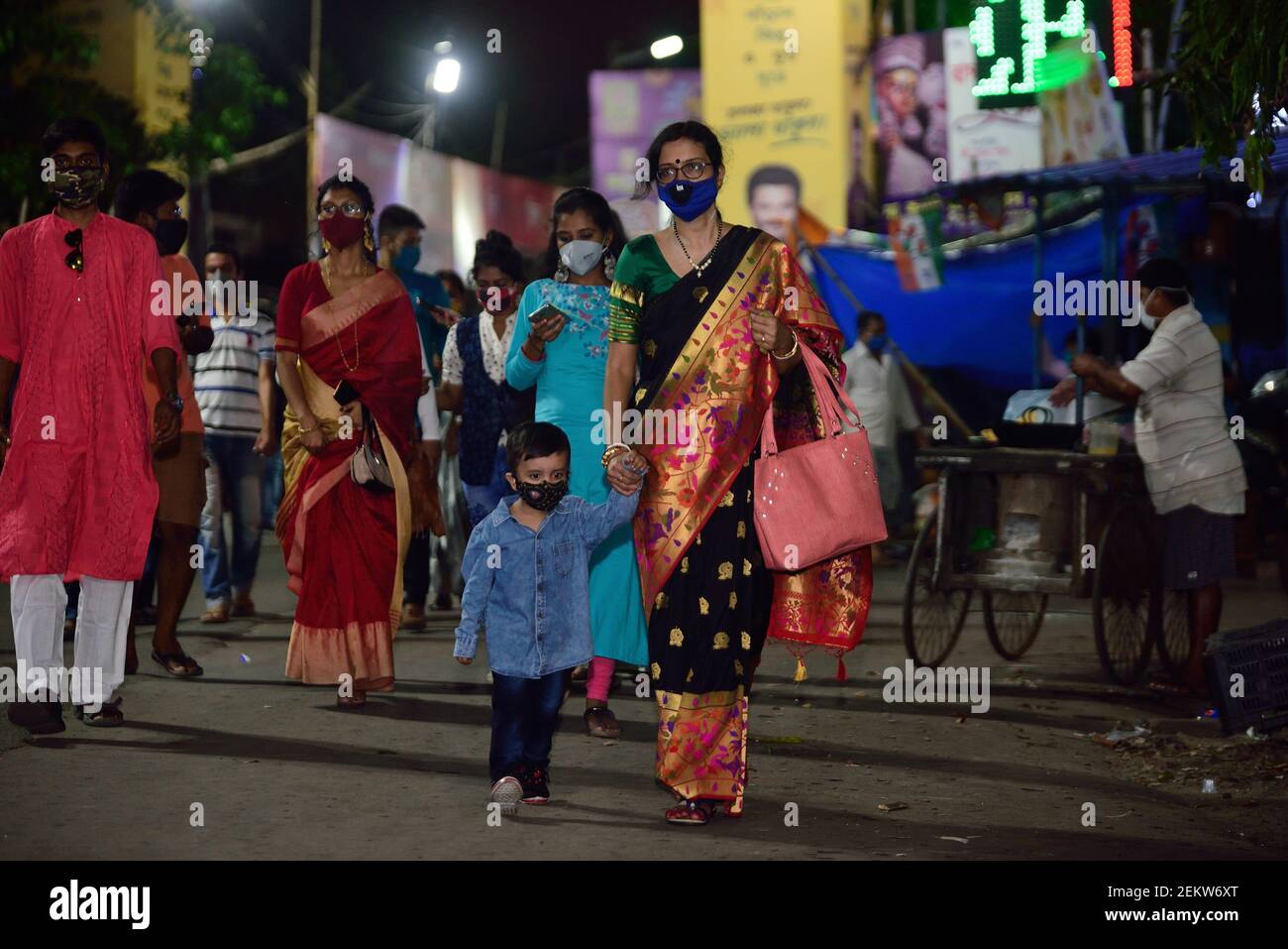 Visitors wearing face masks as a preventive measure visit the Durga ...