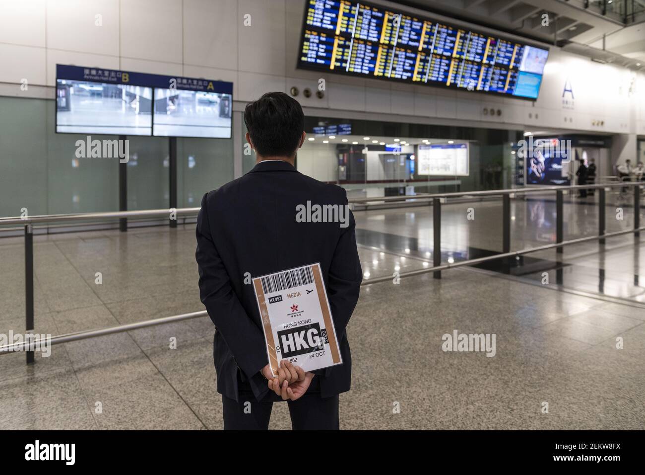 A Hong Kong Airlines employee standing at the arrival hall to welcome ...