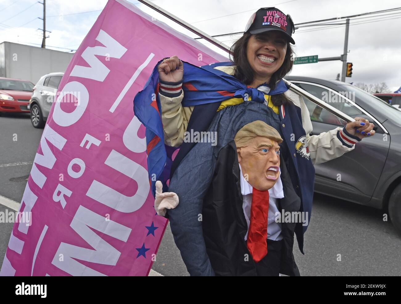 A woman for Trump wears a trump costume while waiting for Joe Biden to ...
