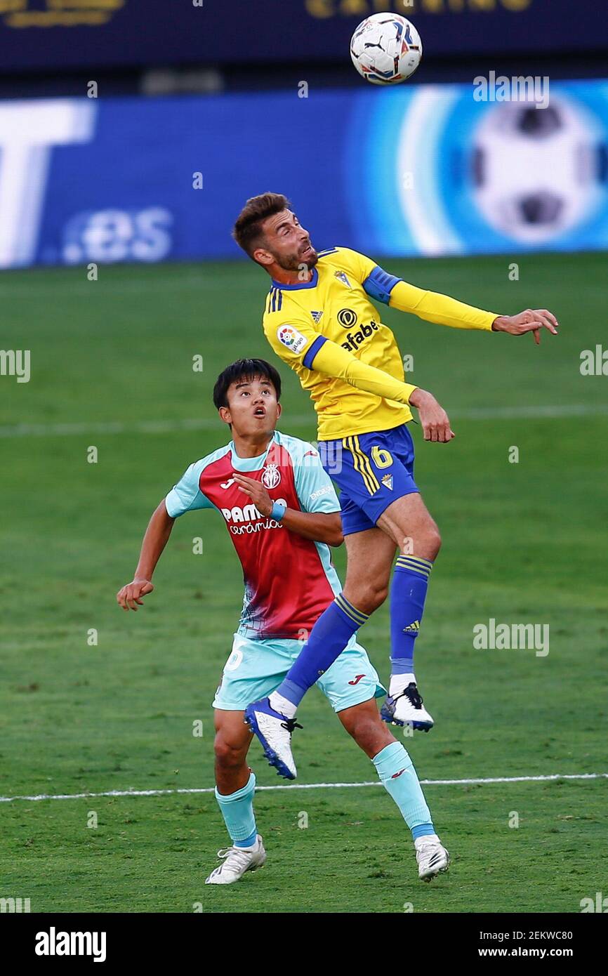 Takefusa Kubo of Villarreal CF and Jose Mari Martin of Cadiz CF during the La Liga match between ...
