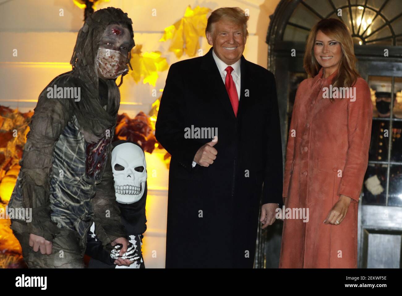 U.S. President Donald Trump and First Lady Melania Trump greet children ...