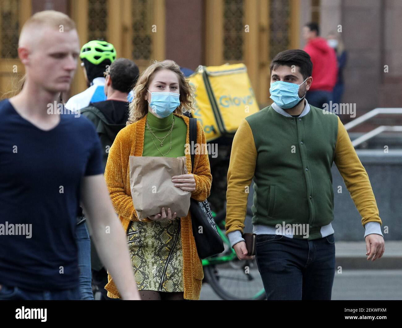 People wearing protective face masks as a precaution walking in ...