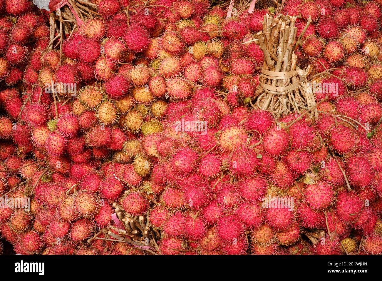 Rambutan skin texture in traditional fruit markets. a fresh red rind ...