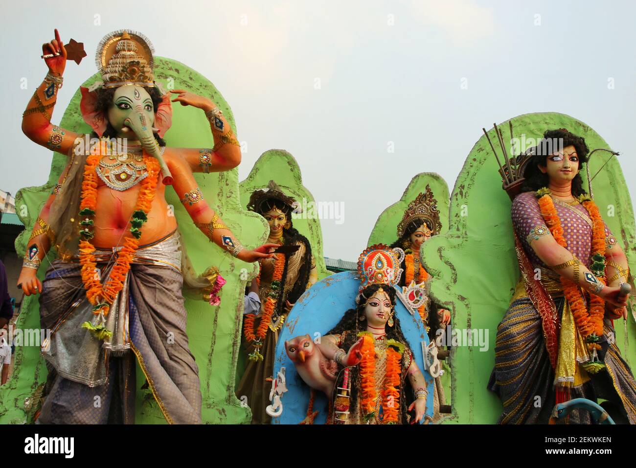 Hindu devotees submerge a clay idol of the Hindu goddess Durga in the ...