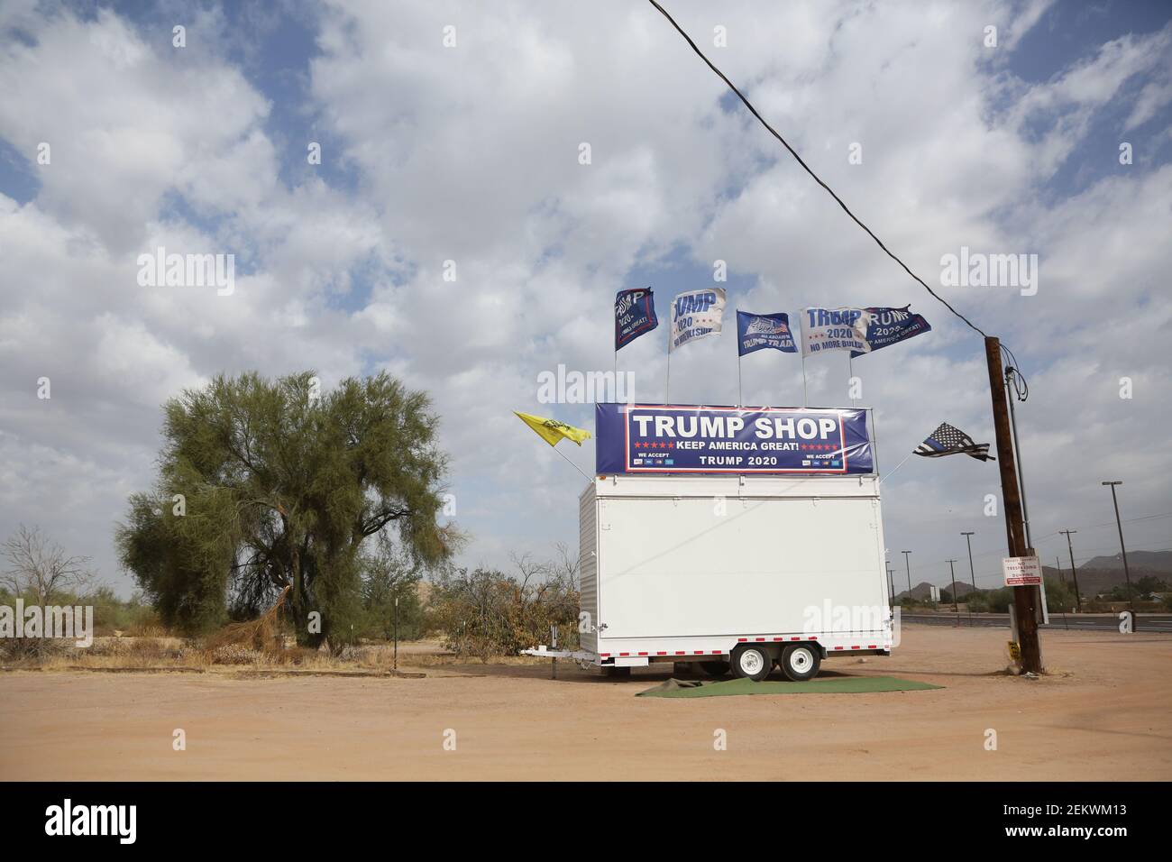 A Trump store pop up stand on a corner near an expressway on ramp in ...