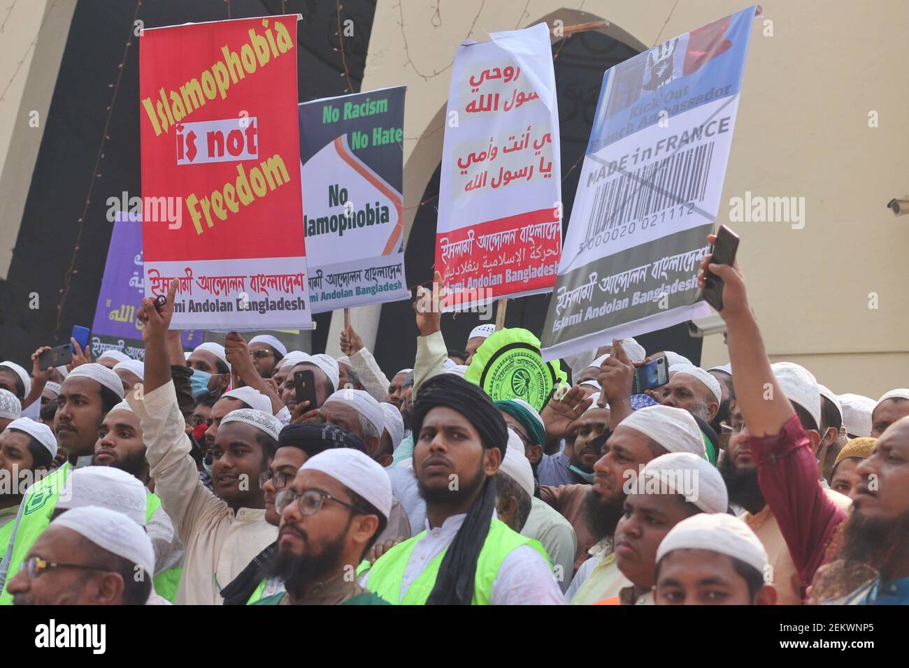 Muslim protesters display placards during the protest in Dhaka. The ...