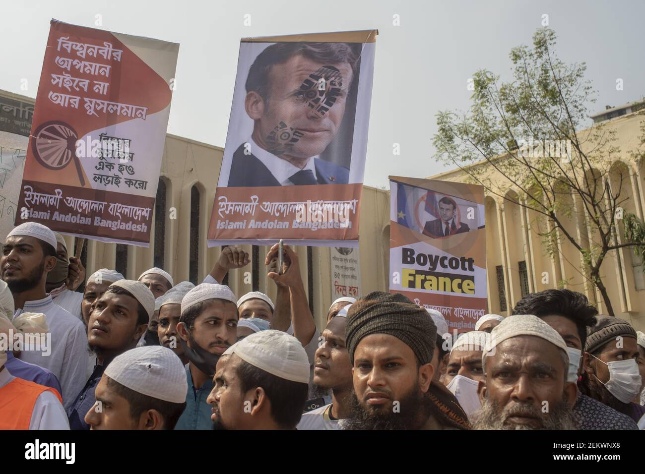 Muslim protesters display placards during the protest against French ...