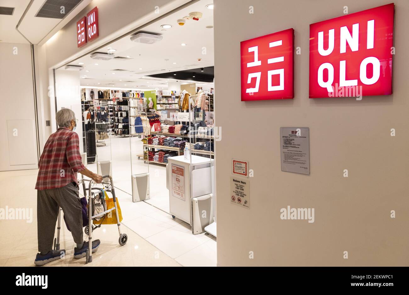 Japanese clothing brand Uniqlo logo and store in Hong Kong. (Photo by ...