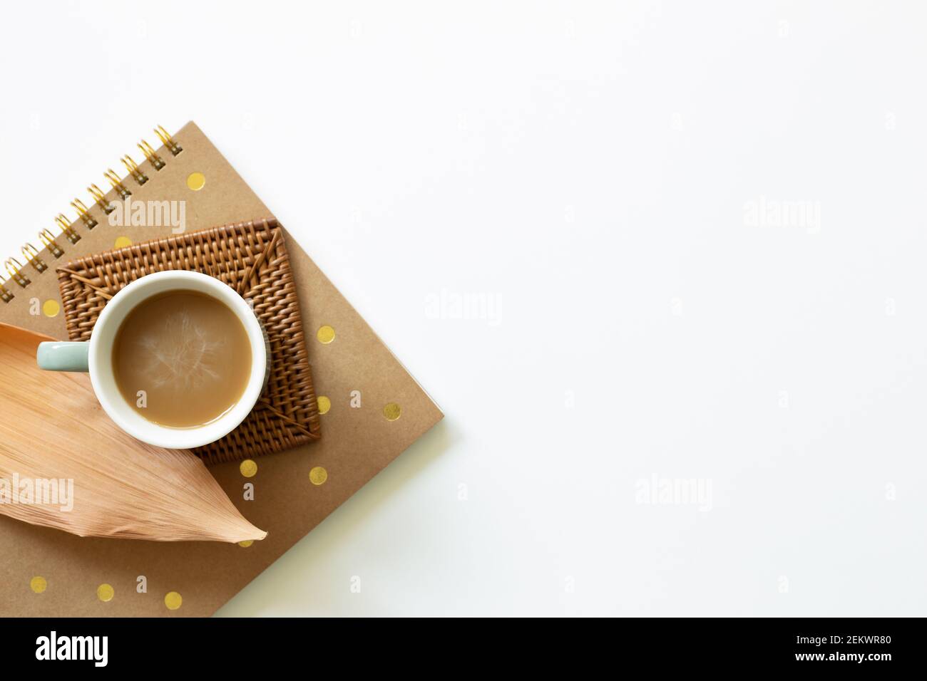 Cup of coffee and notebook on white background. Work and study place ...
