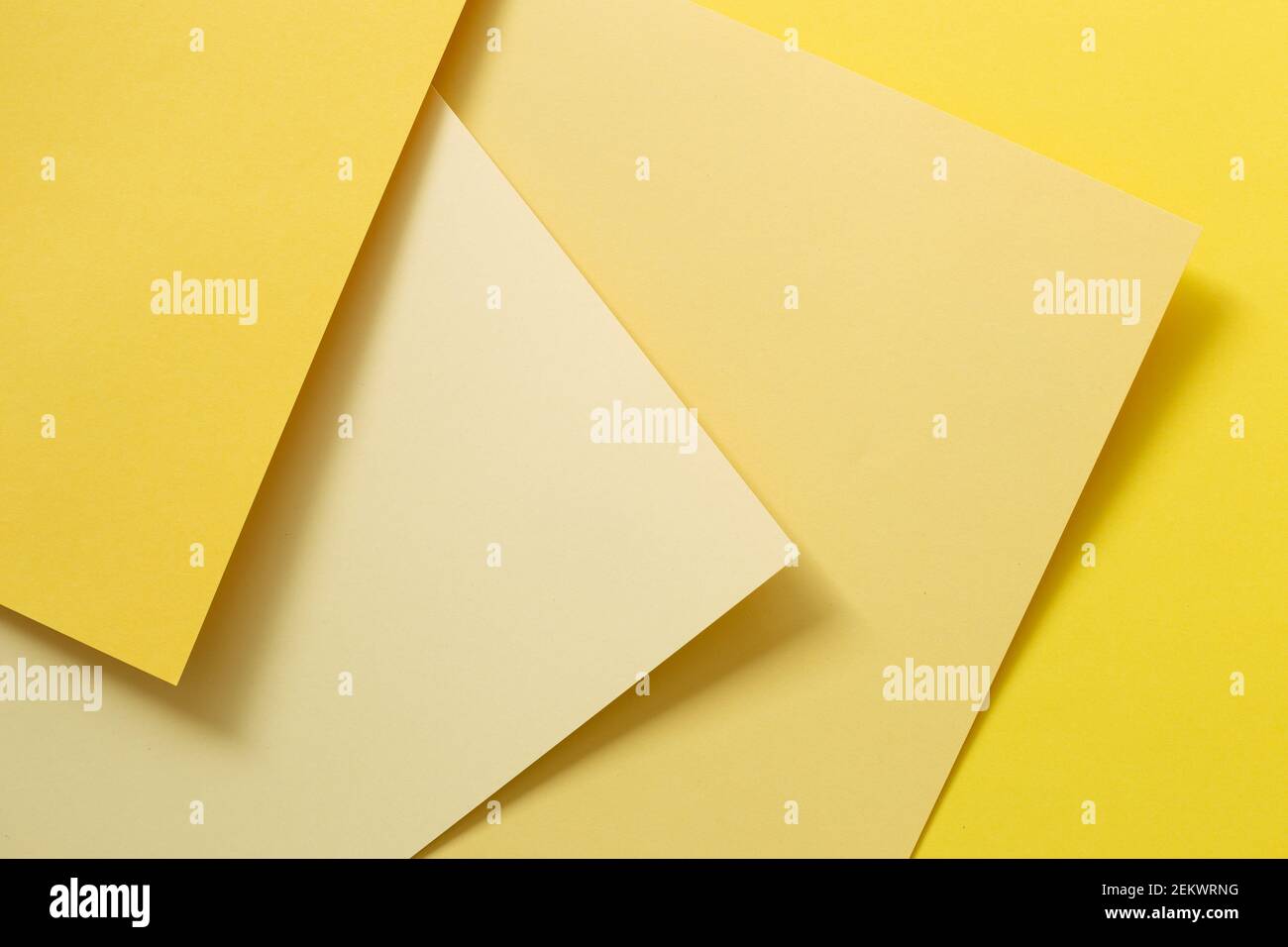Yellow layered color paper background Stock Photo - Alamy