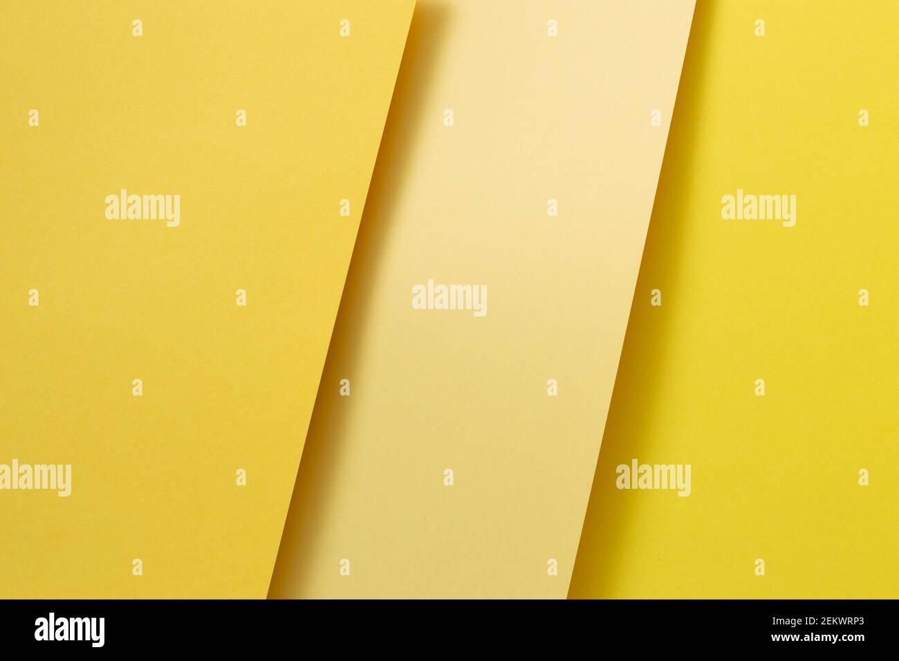 Yellow layered color paper background Stock Photo - Alamy