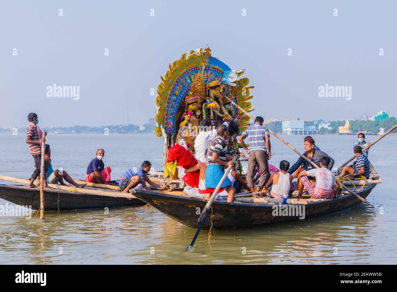 Family members and the priest worshiping 'Durga' idol at the last ...