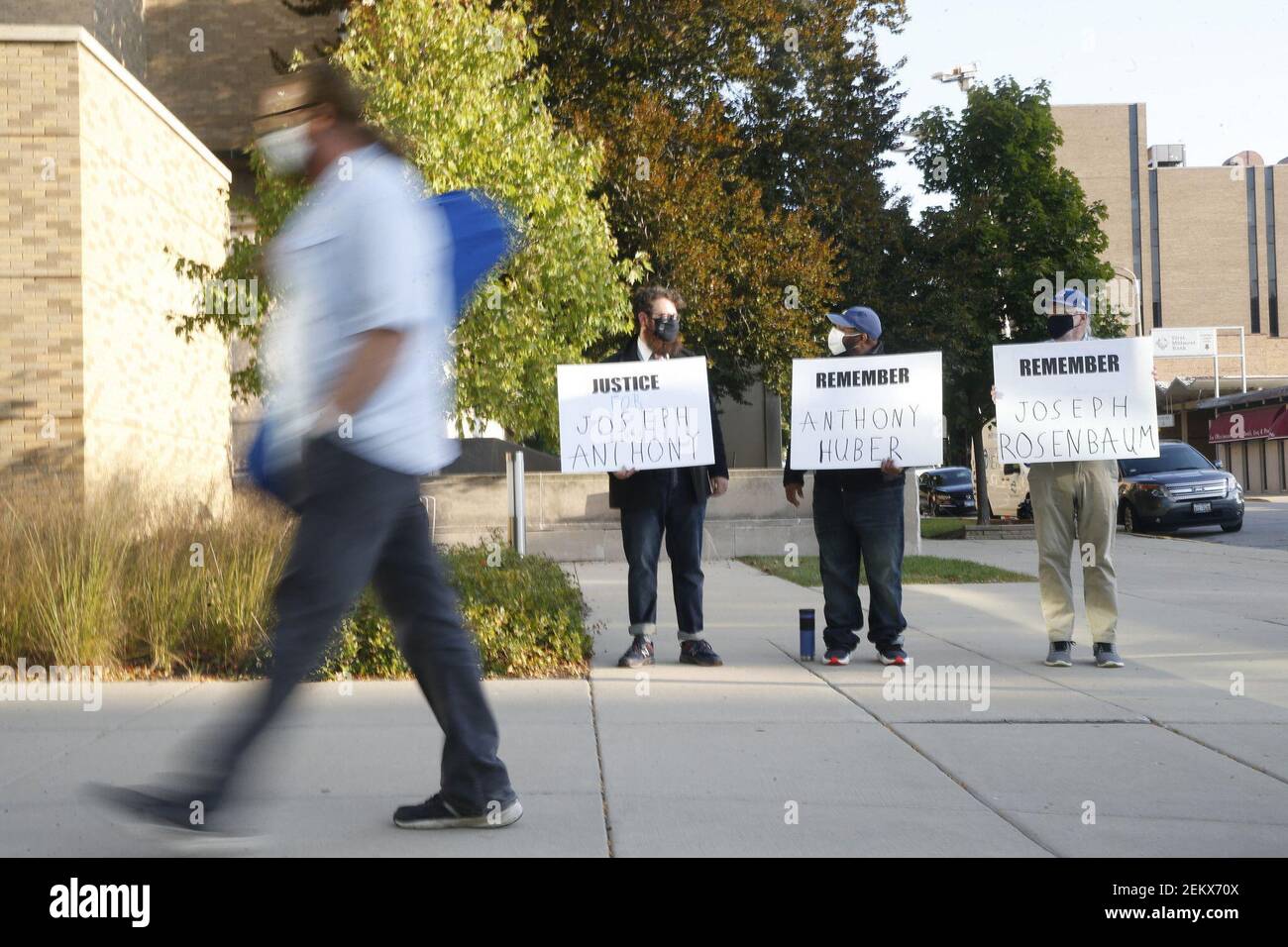 Holding signs, Matt Muchowski of Waukegan, from left, Vance Wyatt of ...
