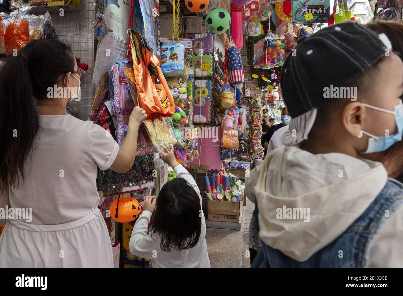 People buying costumes at a gift and decorative product shop on ...