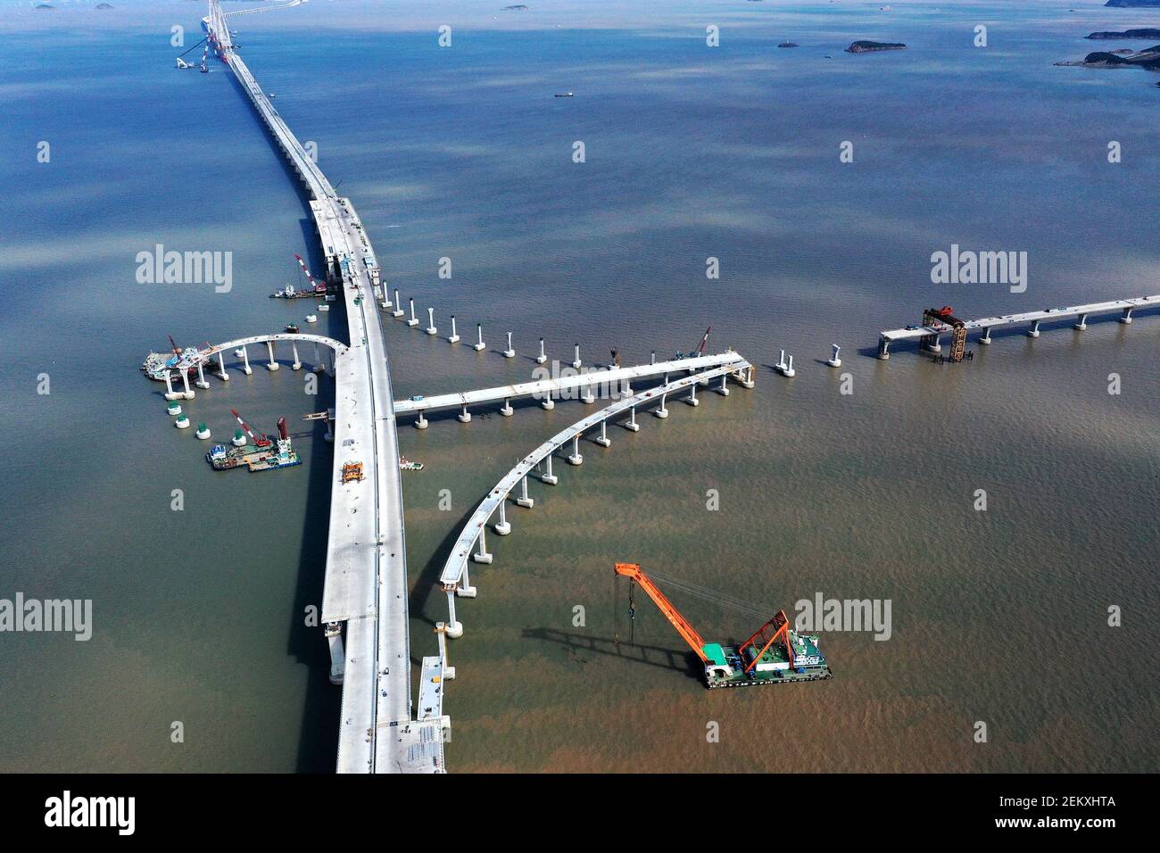 An aerial view of workers building the Zhoudai Bridge, which connect ...