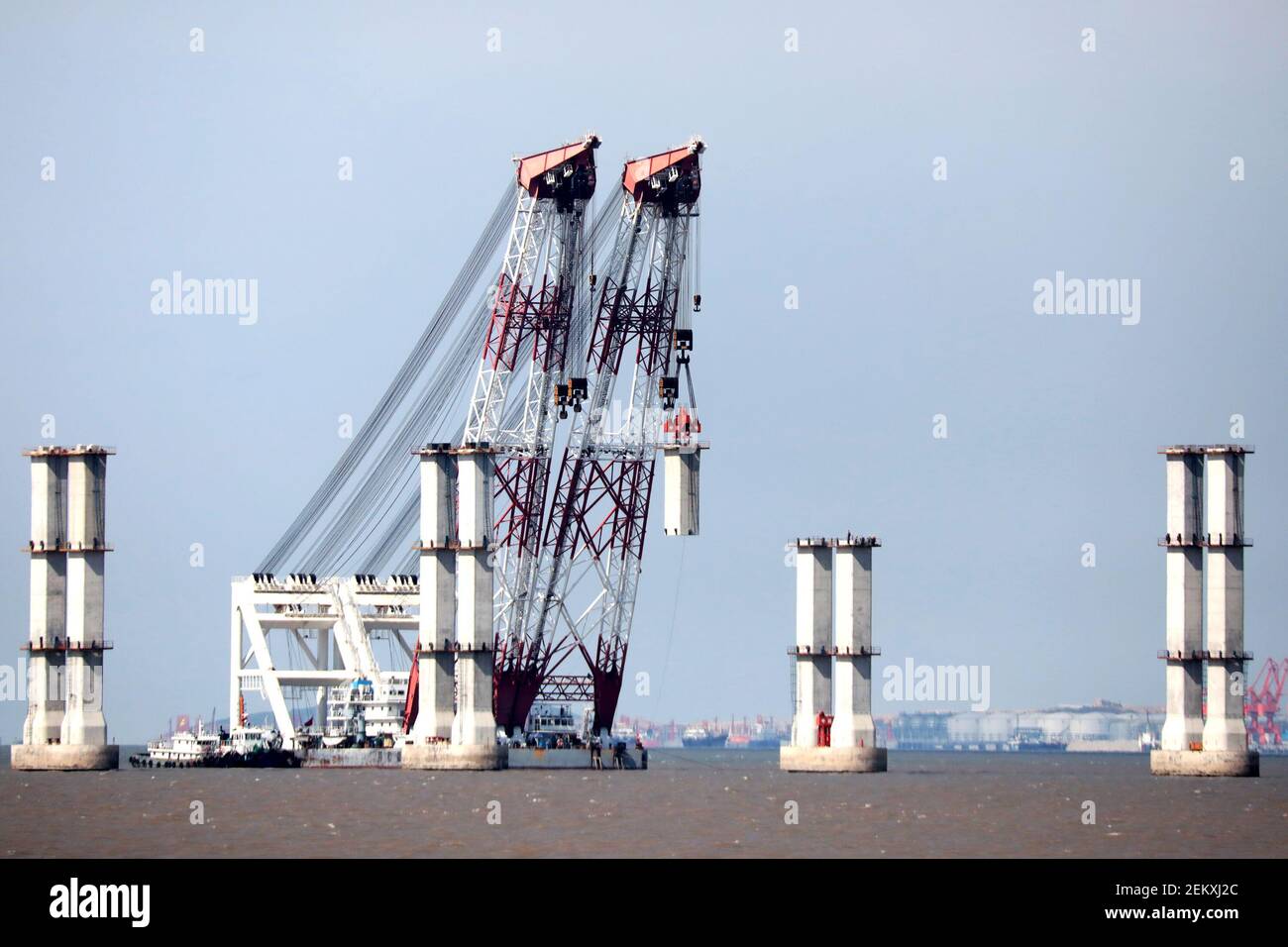 An aerial view of a crane working to build the Zhoudai Bridge, which ...