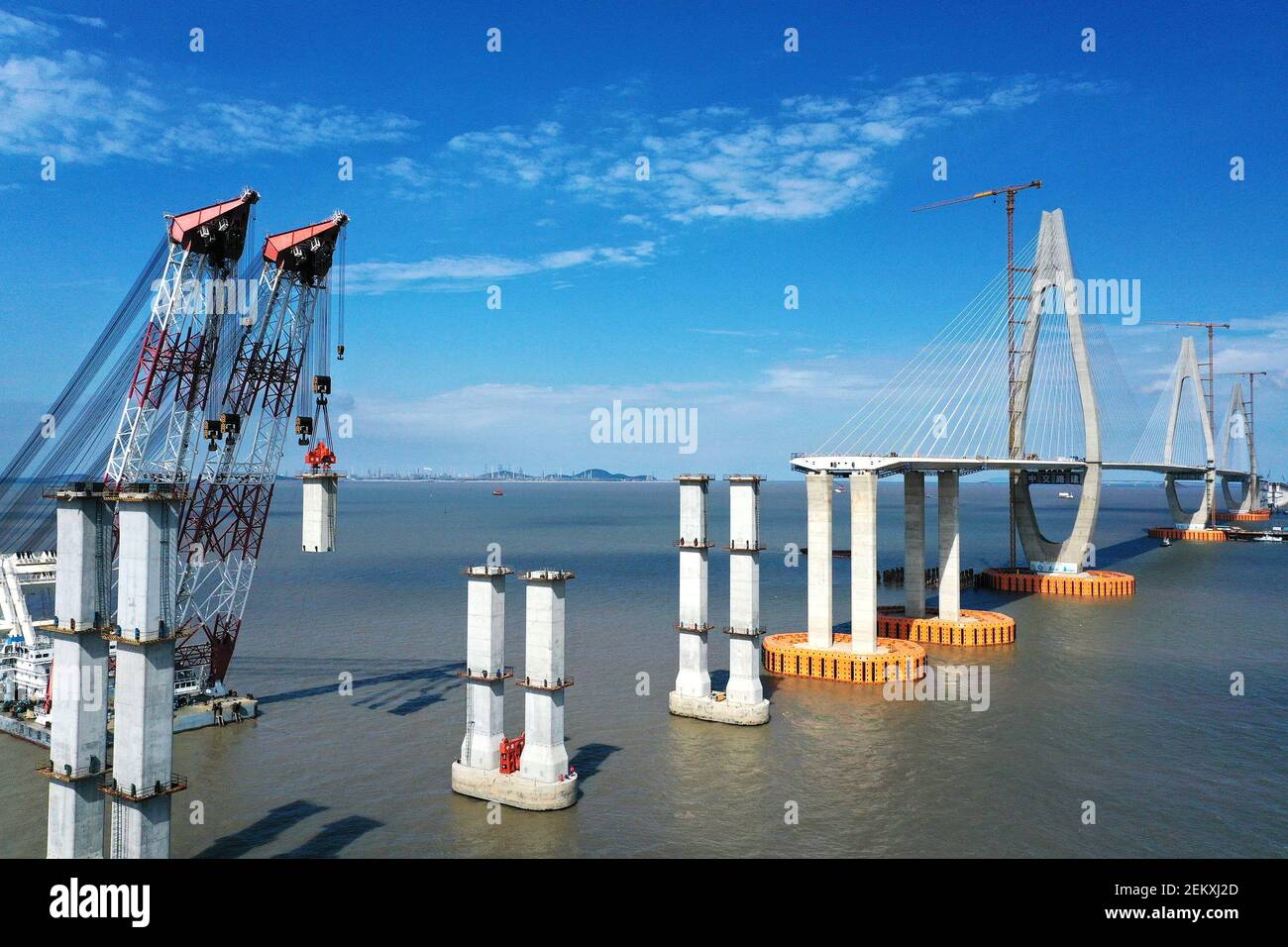 An aerial view of a crane working to build the Zhoudai Bridge, which ...