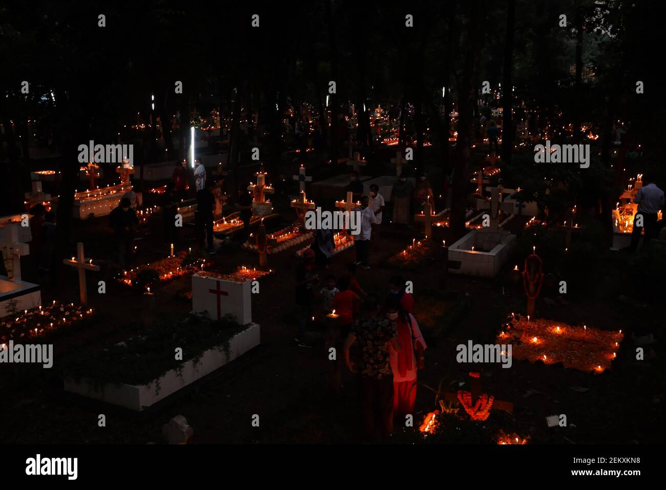 Catholic community members offer prayers for the dead at a Dhaka ...