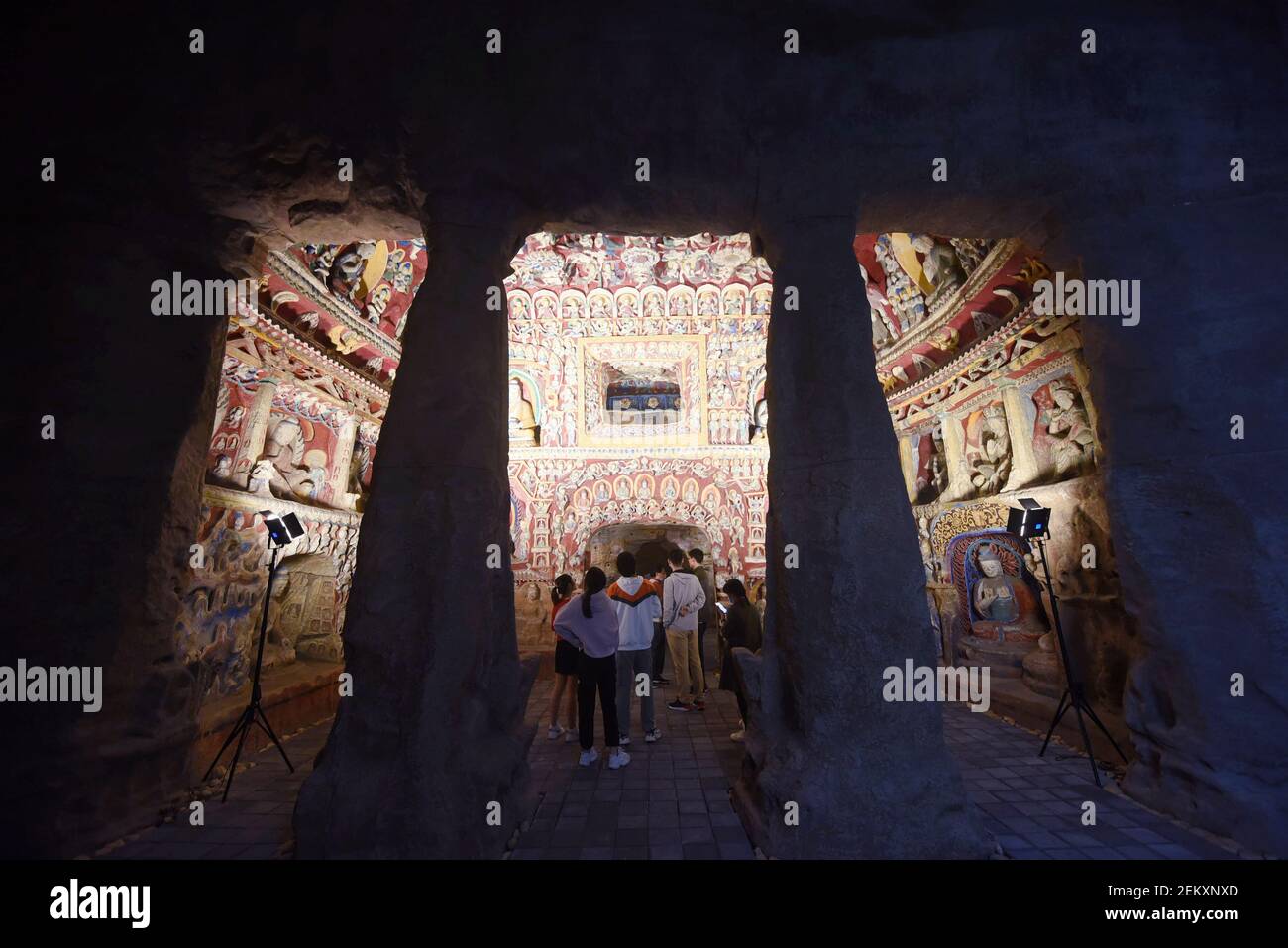 Visitors take a tour of the immovable Yungang Grottoes, the 1,500-year ...