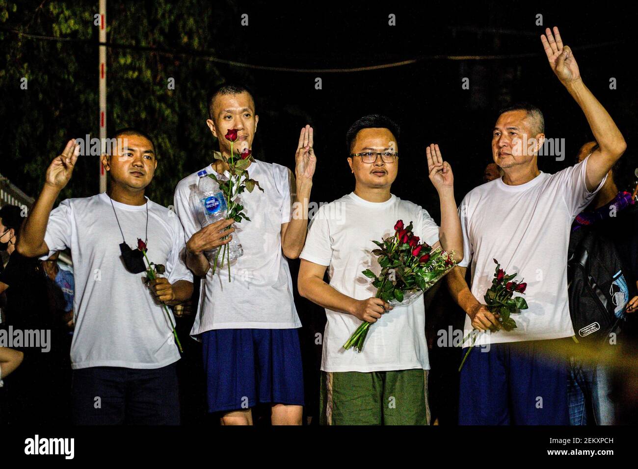 Anon Numpha and other pro-democracy protest leaders raise up the three ...