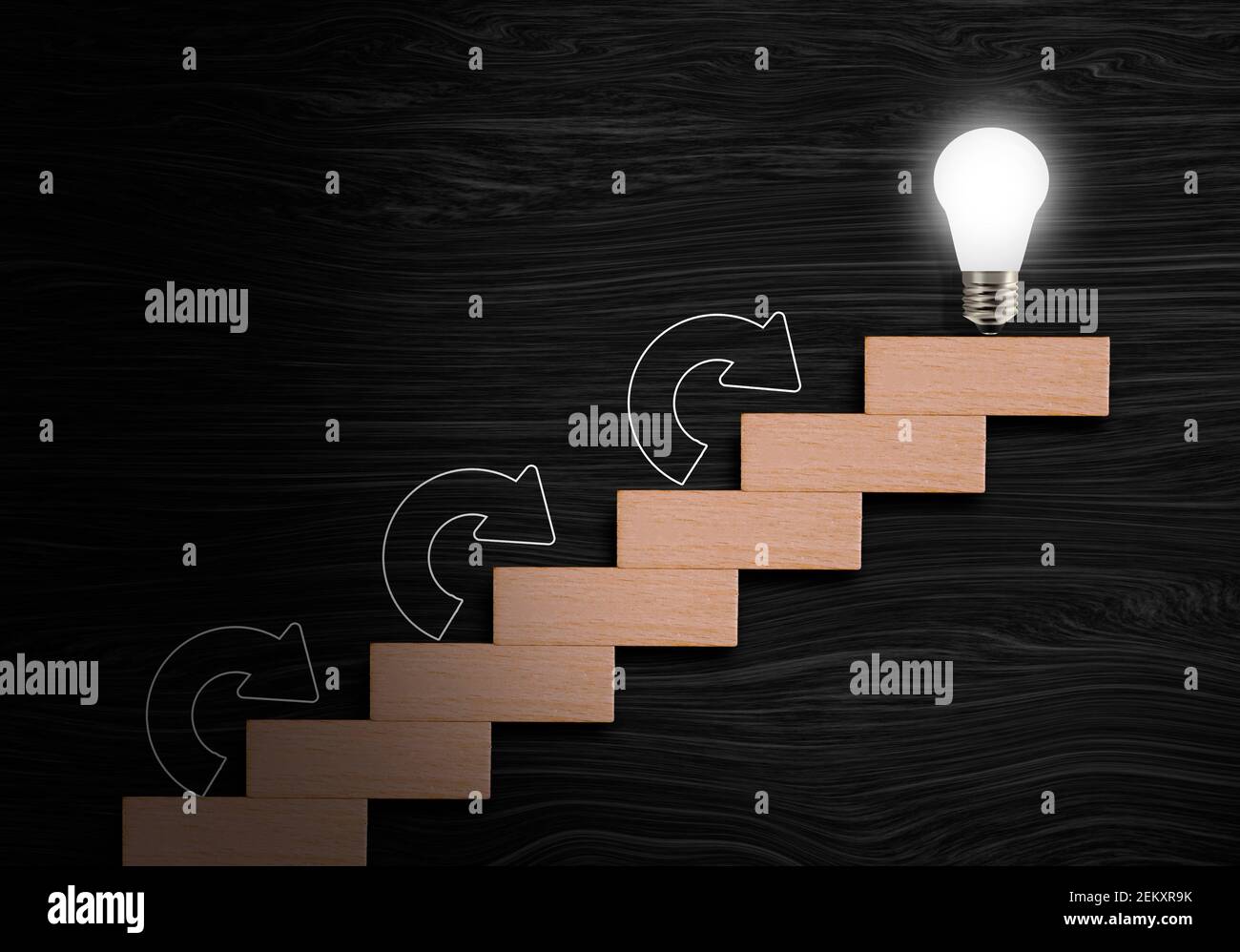 step by step to the top, glowing light bulb and ascending stairs ...