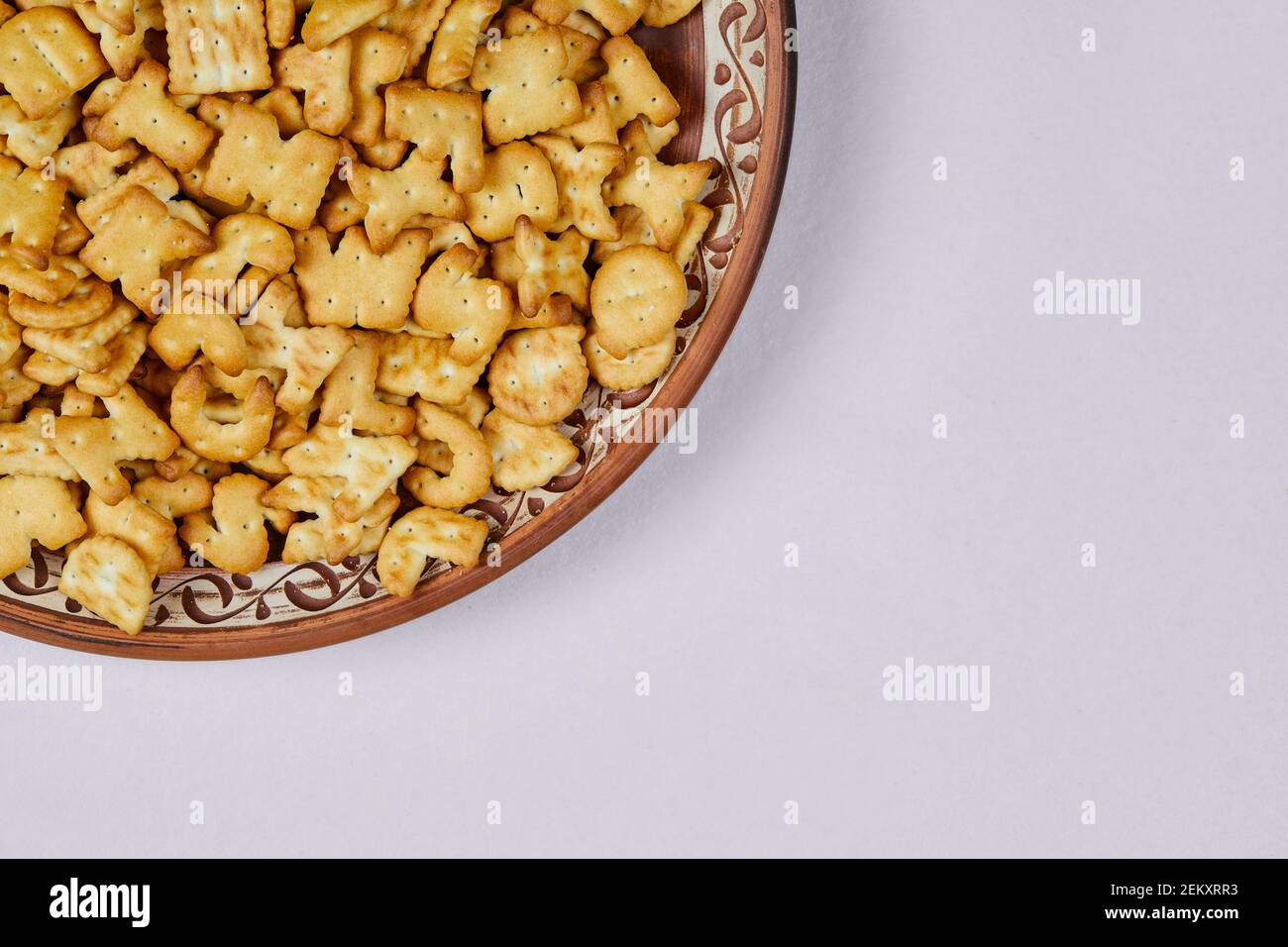 Alphabet crackers on a ceramic plate Stock Photo - Alamy