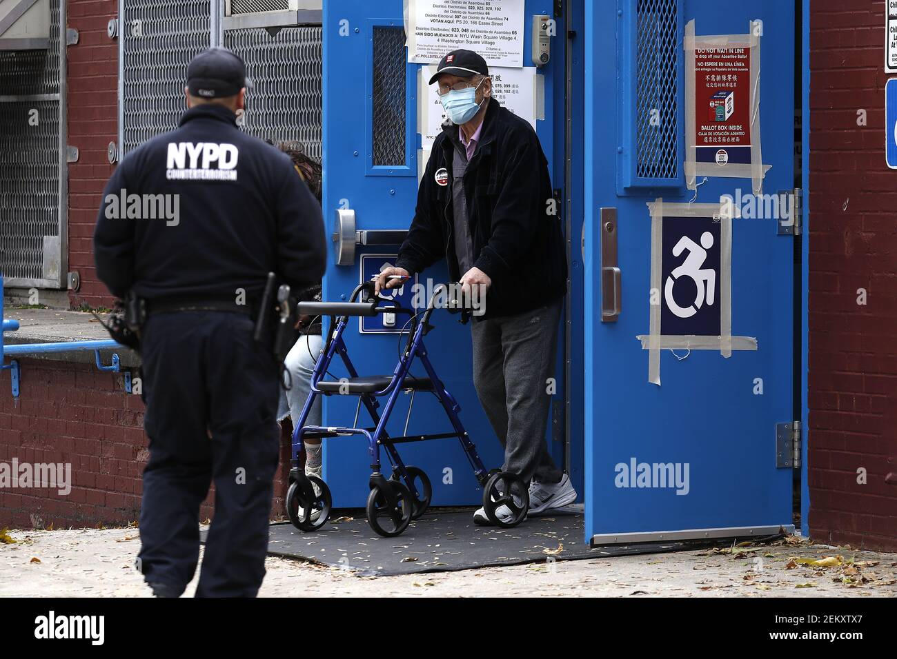 New York City residents are seen in front of Lower East Side polling ...