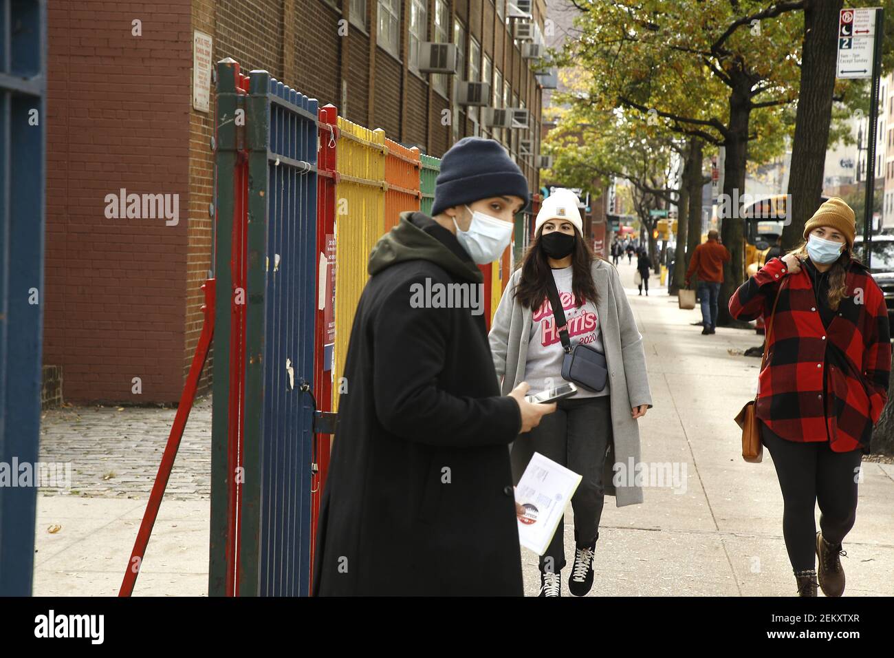 New York City residents are seen in front of Lower East Side polling ...