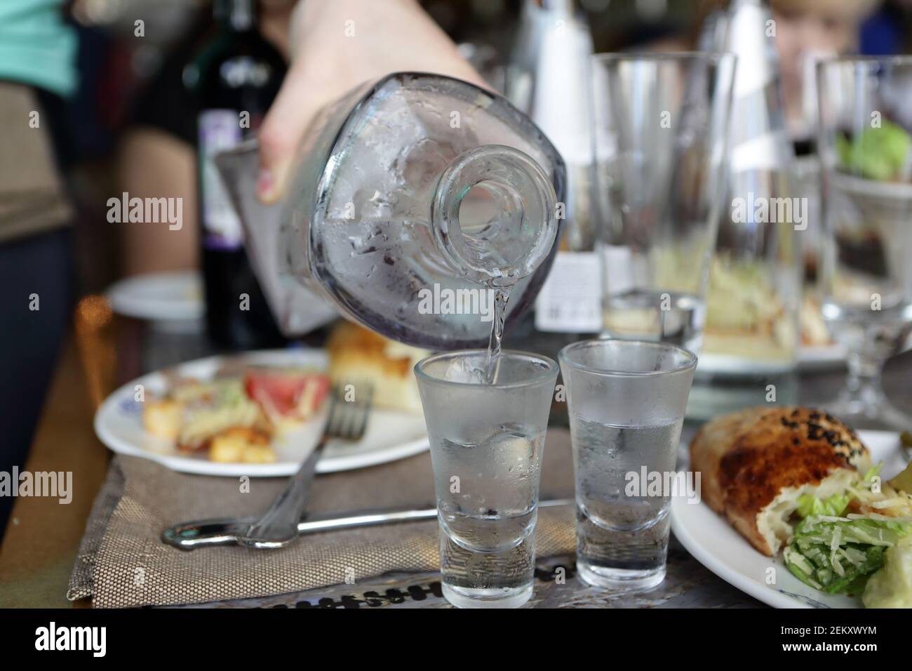 Waiter pouring vodka from crystal hi-res stock photography and images ...