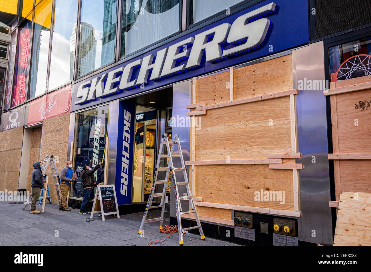 Skechers, one of the many storefront businesses boarded in Times Square ...