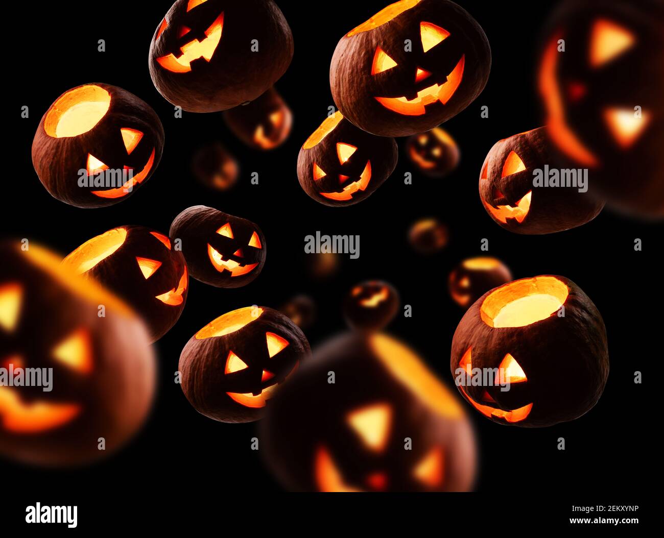 Glowing pumpkins levitate on a black background Stock Photo - Alamy