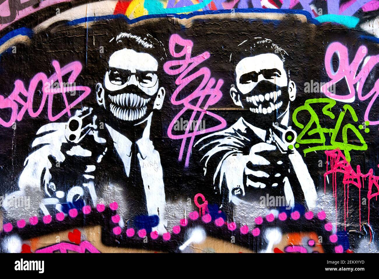 Graffiti of The Kray twins holding guns while wearing face masks at ...