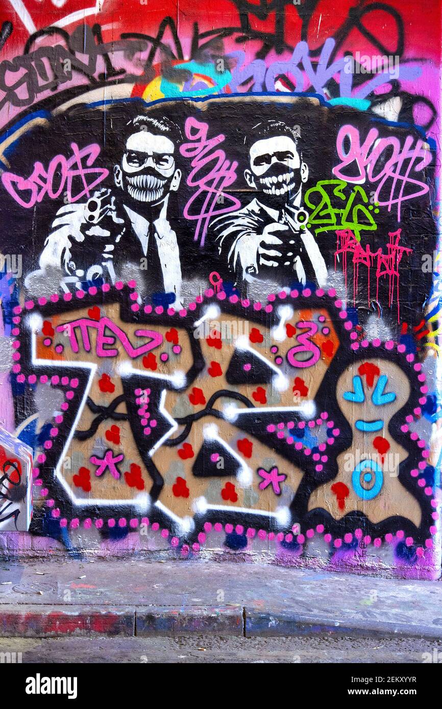 Graffiti of The Kray twins holding guns while wearing face masks at ...