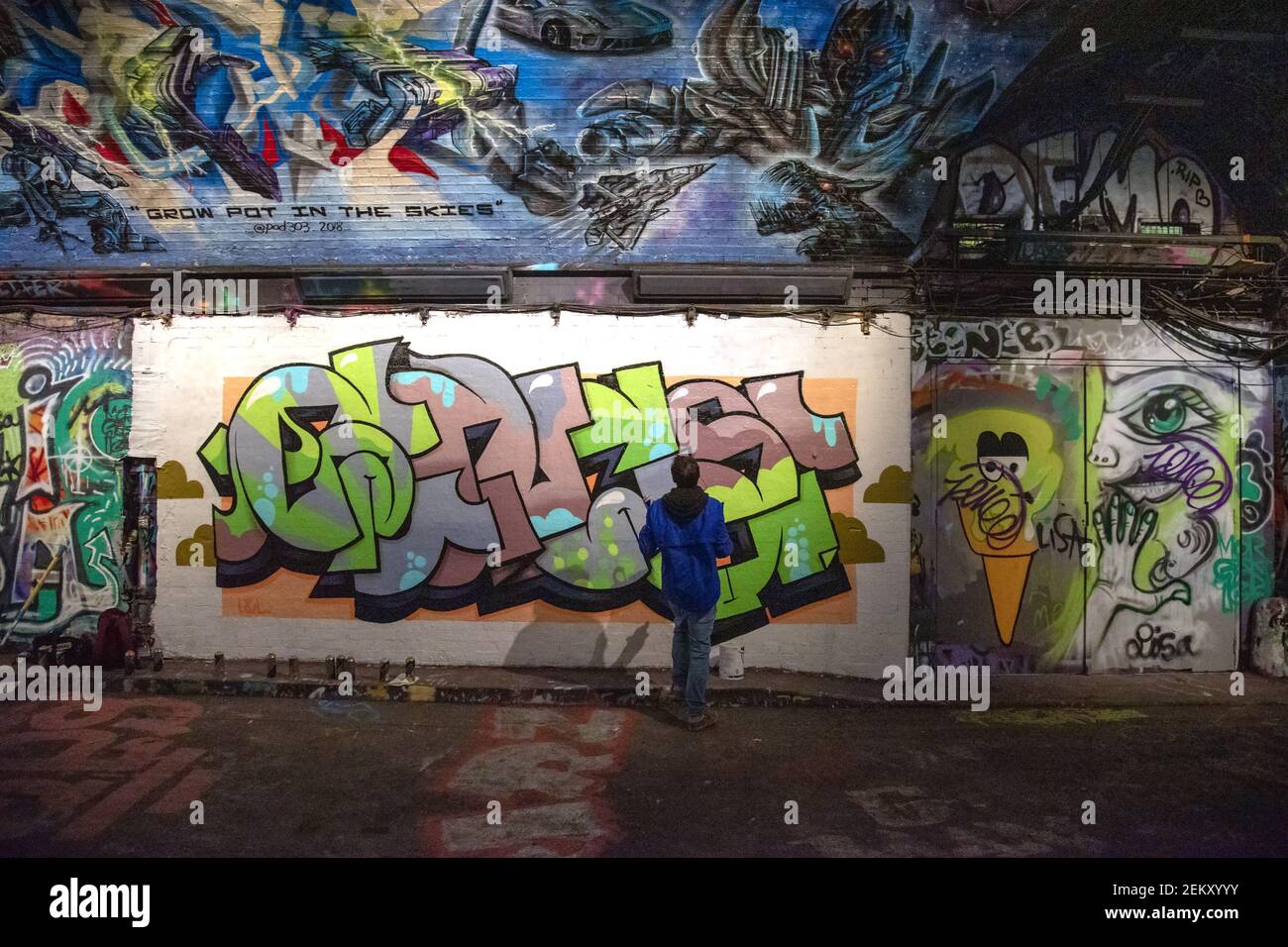 A graffiti artist seen painting at the famous Leake Street Tunnel under ...