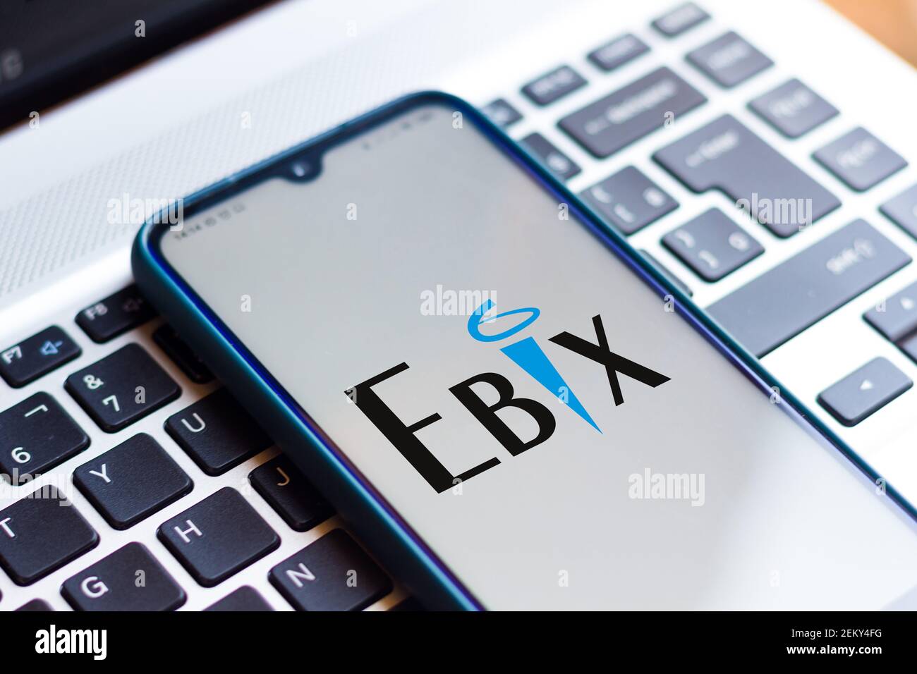 In this photo illustration the Ebix logo seen displayed on a smartphone ...