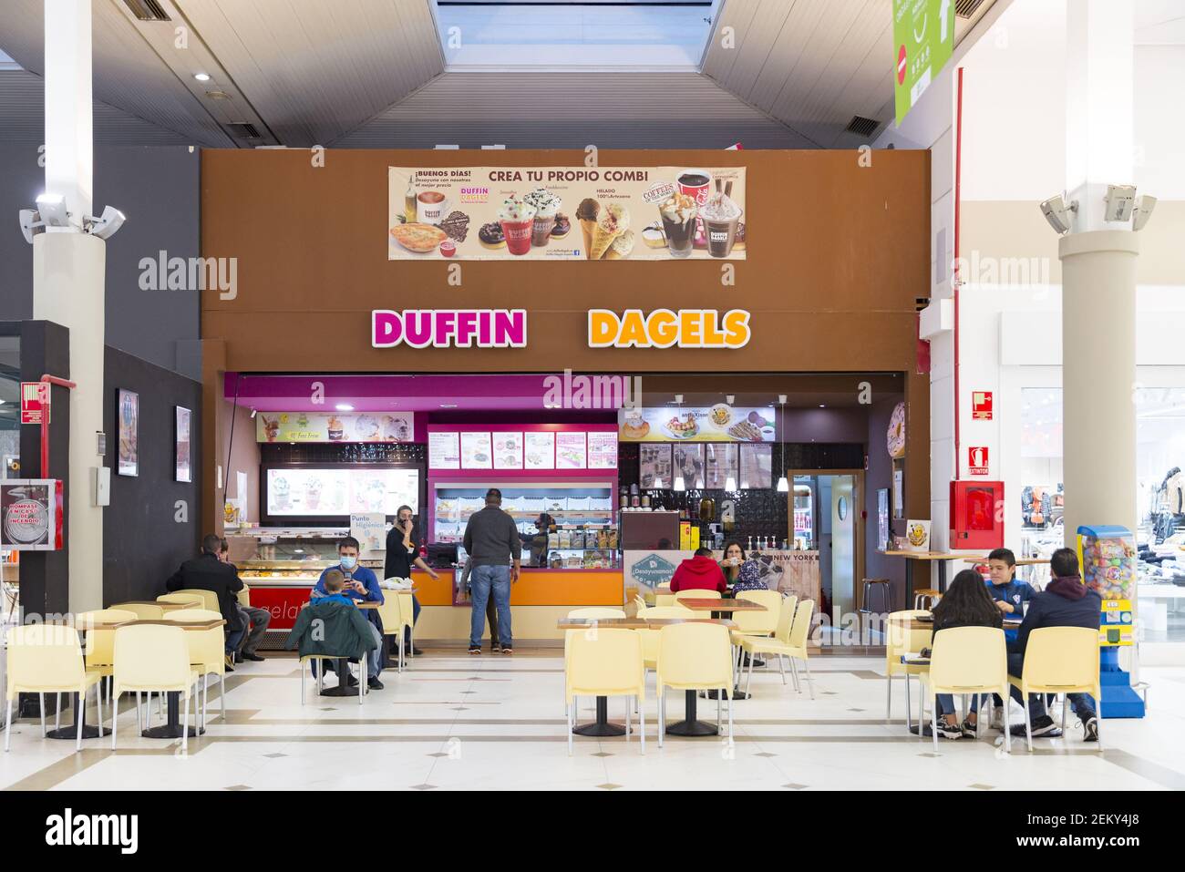People sitting in the multinational Duffin Dagels during the state of ...