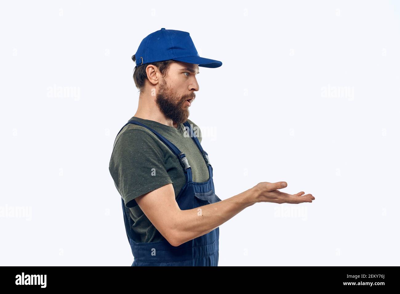 man in work uniform blue cap service work professional Stock Photo - Alamy